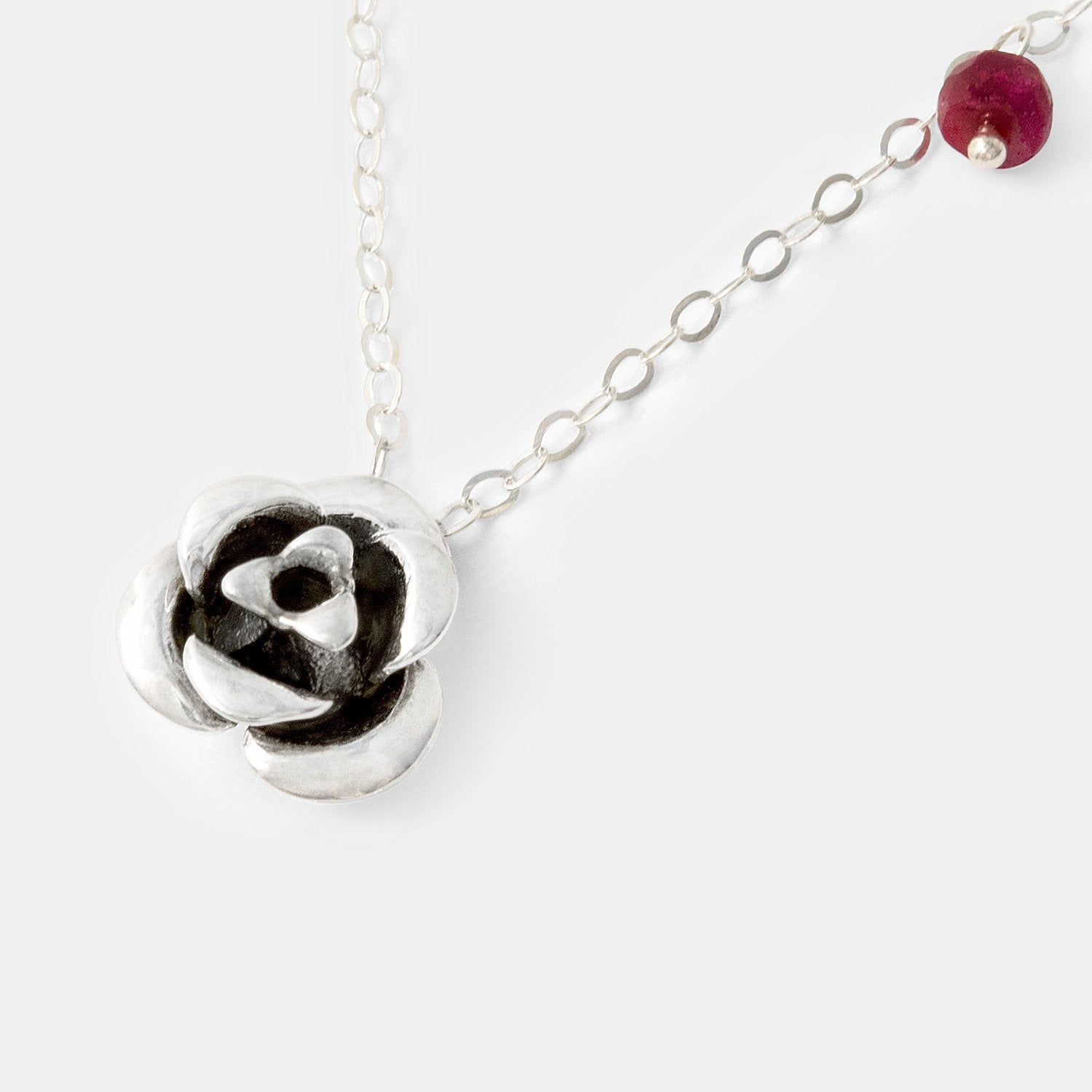 Shapely Rose Pendant Necklace | Sterling Silver & Ruby Gem